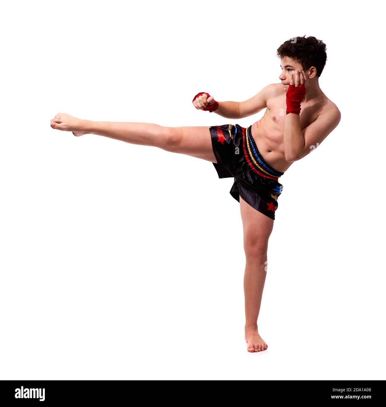 Young kickboxer training shadow boxing, isolated on white background ...