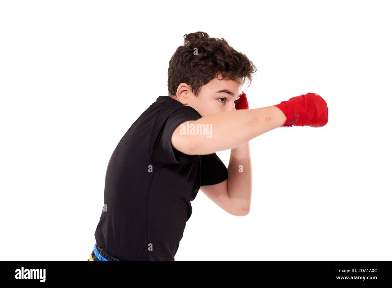 Young kickboxer training shadow boxing, isolated on white background ...