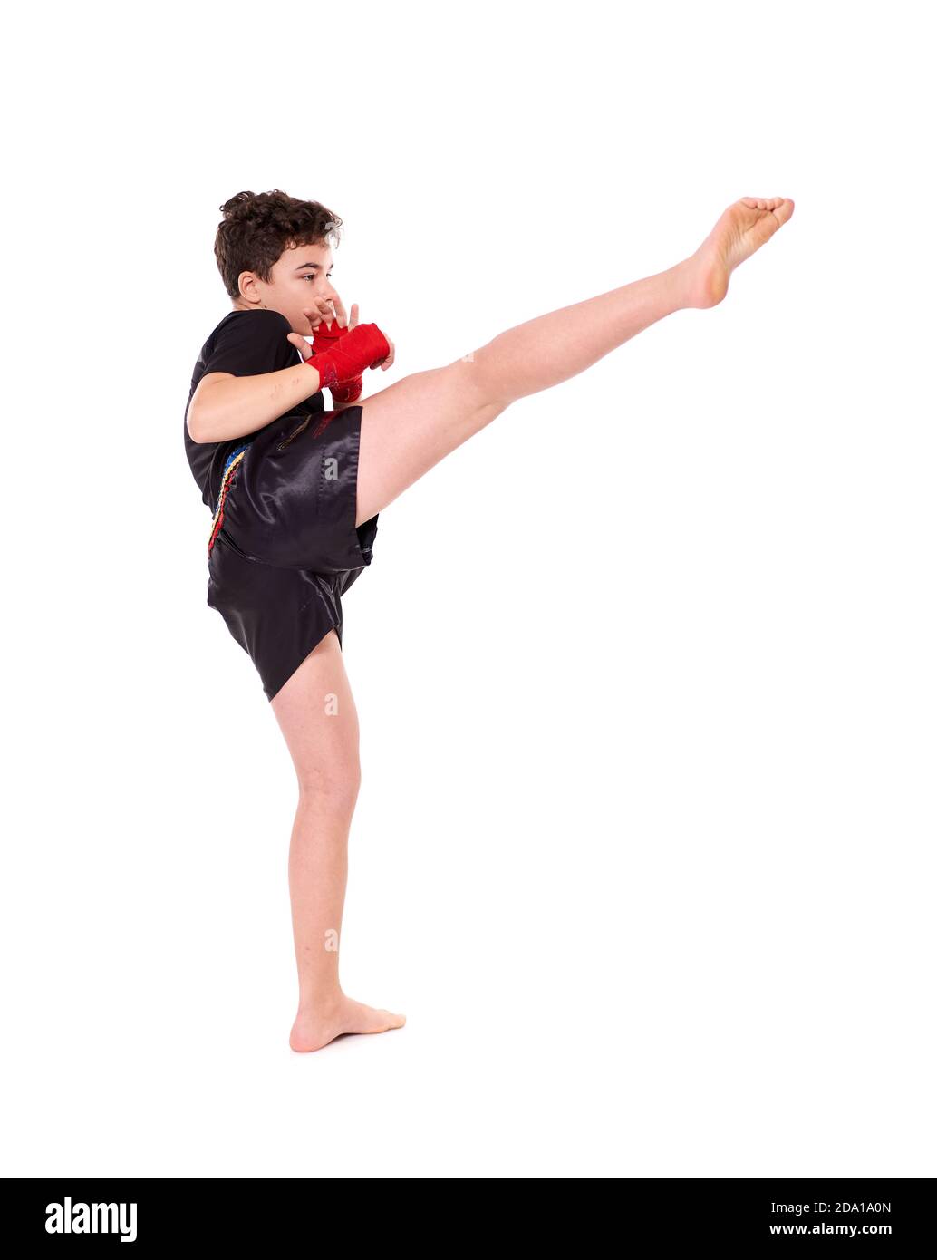 Young kickboxer training shadow boxing, isolated on white background ...