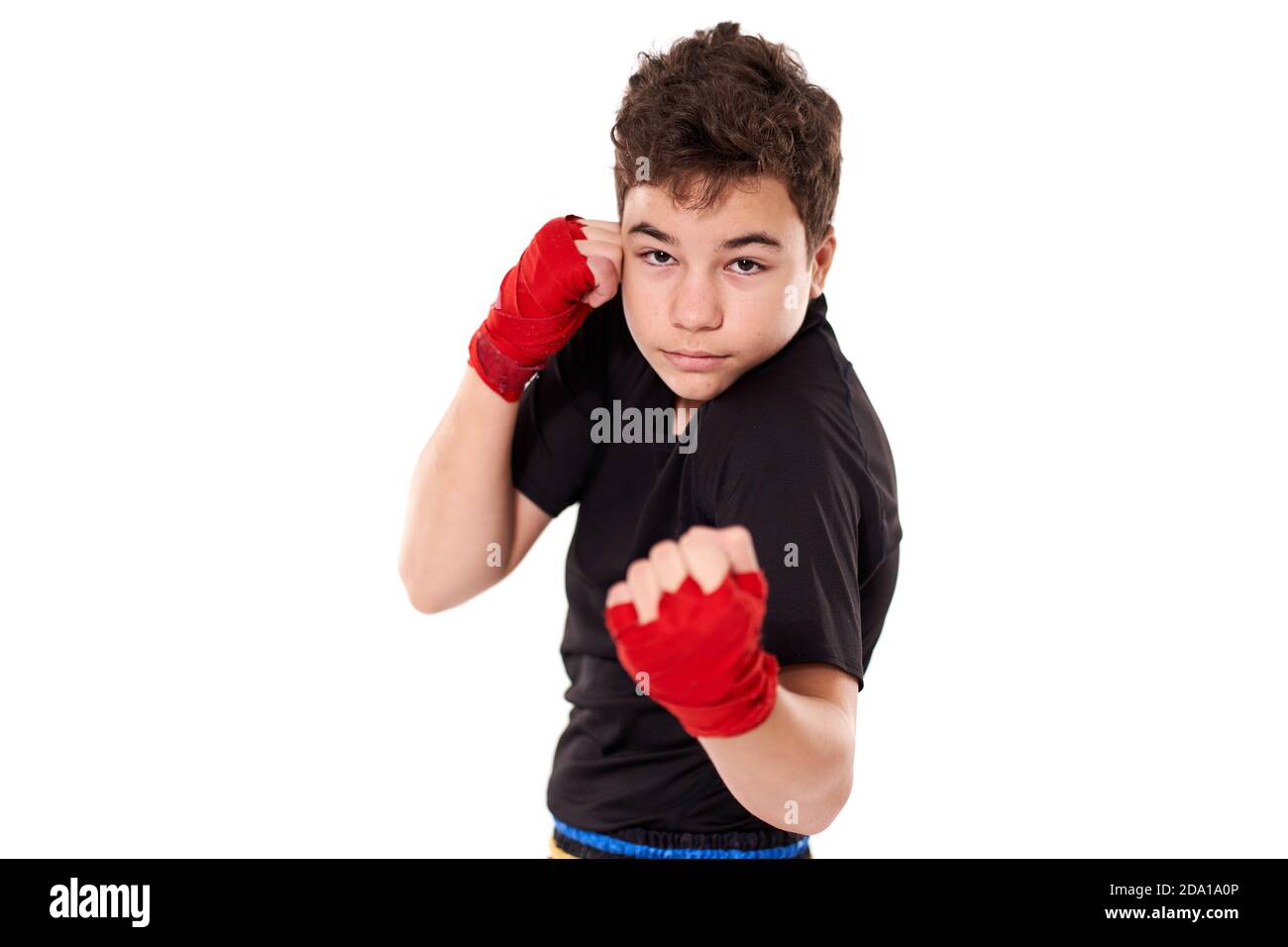 Young kickboxer training shadow boxing, isolated on white background ...