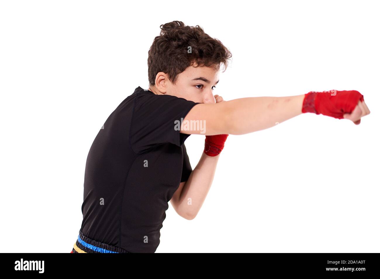 Young kickboxer training shadow boxing, isolated on white background ...