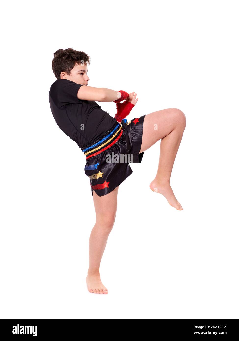 Young kickboxer training shadow boxing, isolated on white background ...