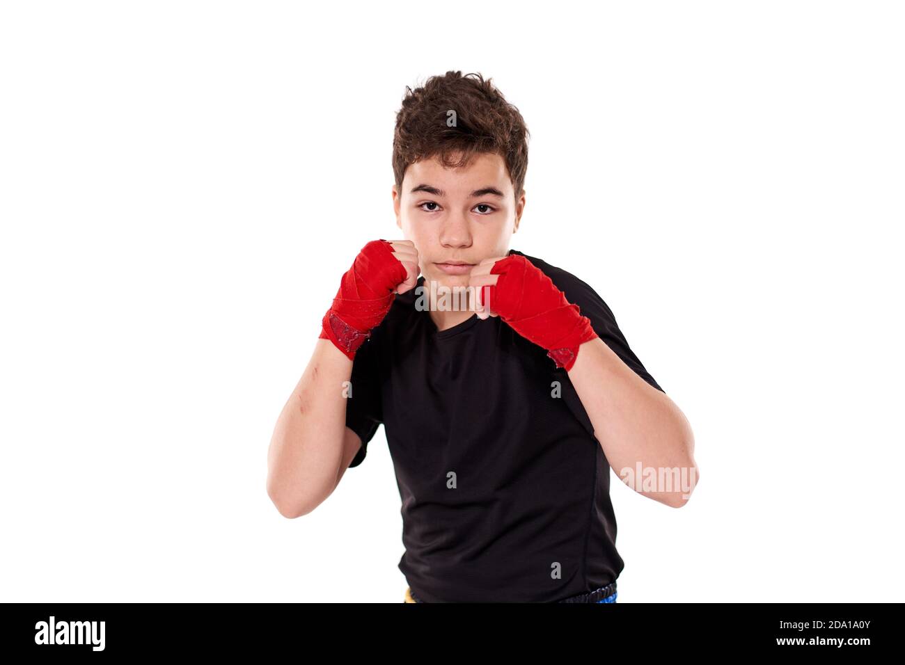 Young kickboxer training shadow boxing, isolated on white background ...