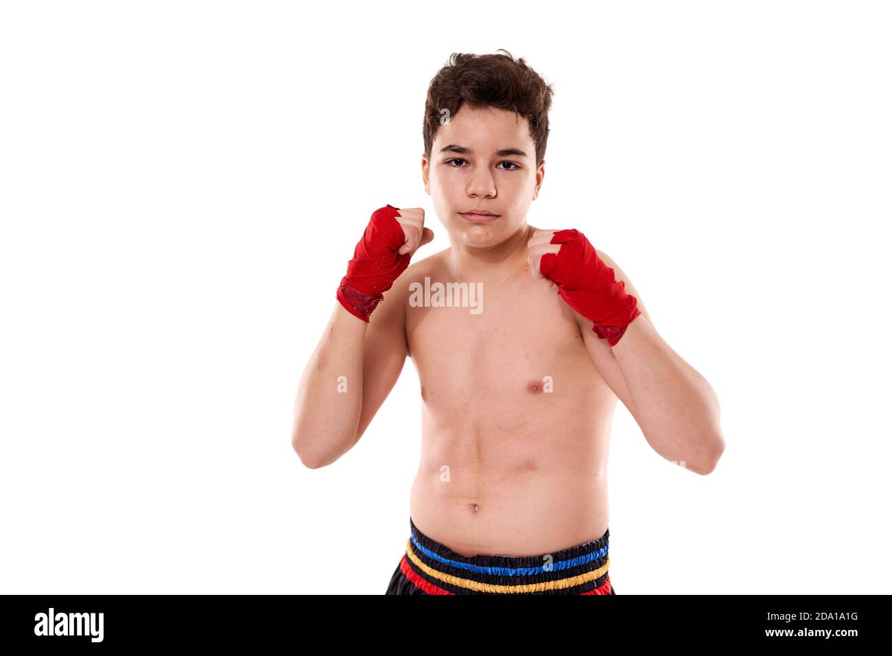 Young kickboxer training shadow boxing, isolated on white background ...