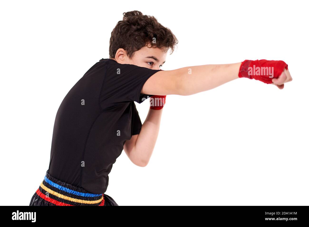 Young kickboxer training shadow boxing, isolated on white background ...