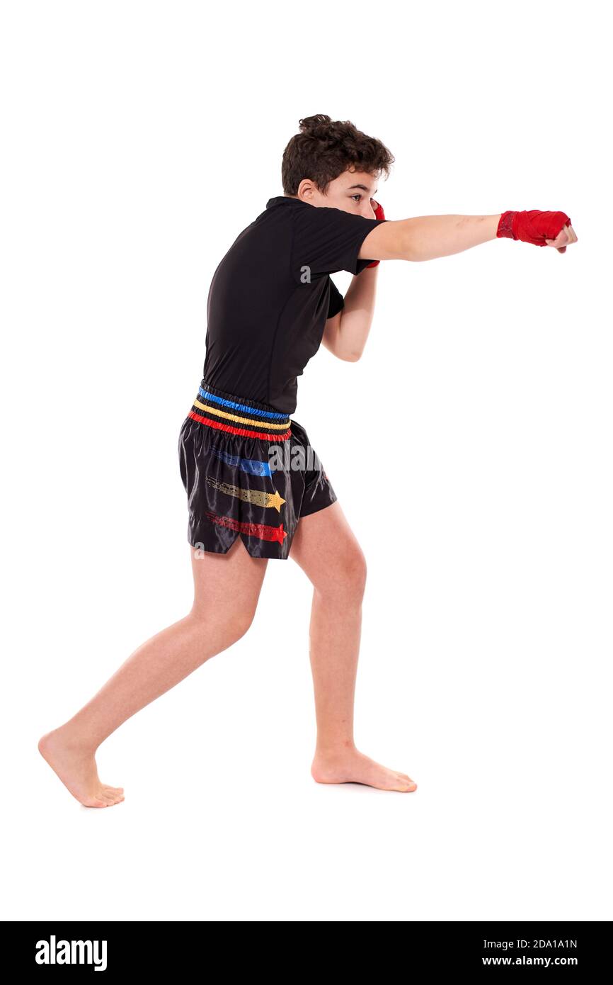 Young kickboxer training shadow boxing, isolated on white background ...