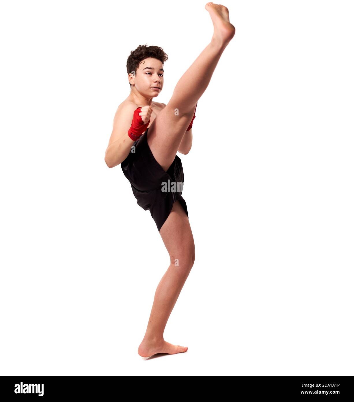 Young kickboxer training shadow boxing, isolated on white background ...