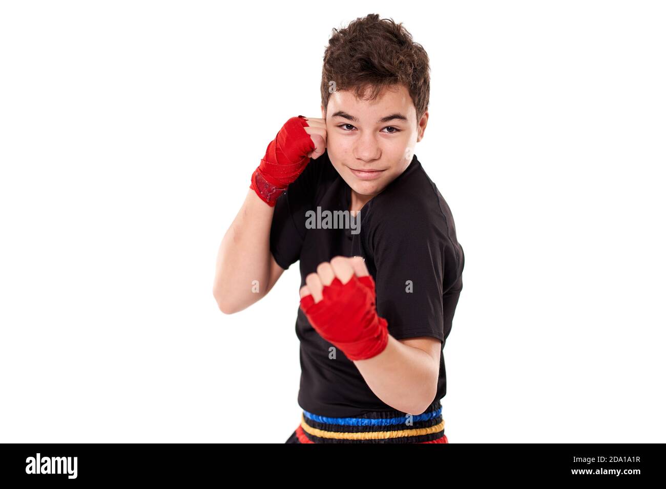 Young kickboxer training shadow boxing, isolated on white background ...