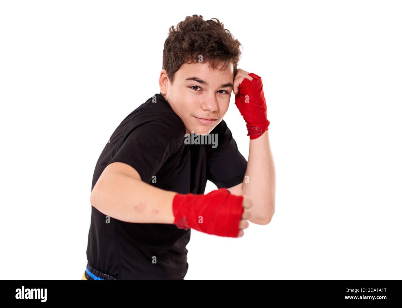 Young kickboxer training shadow boxing, isolated on white background ...