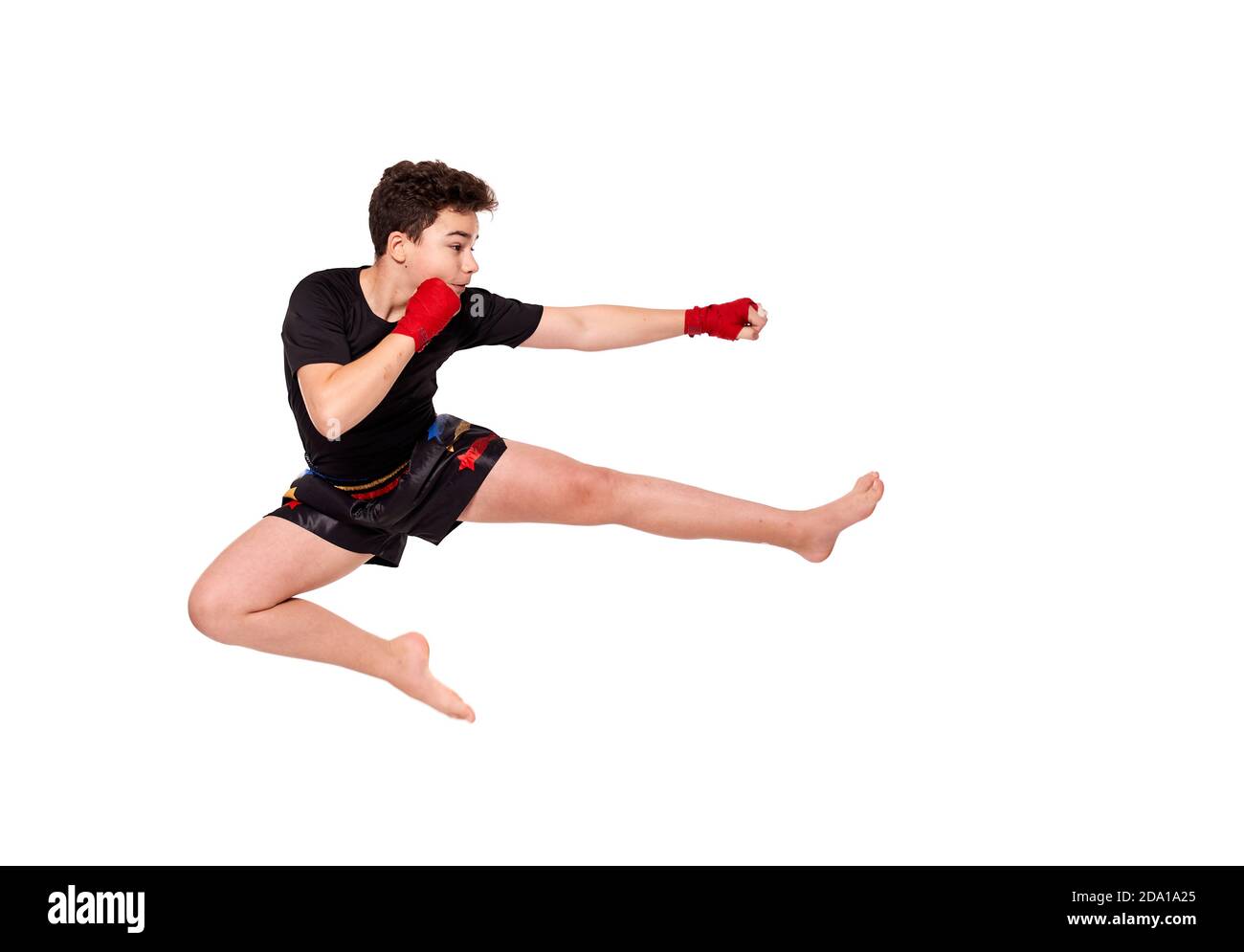 Young kickboxer training shadow boxing, isolated on white background ...