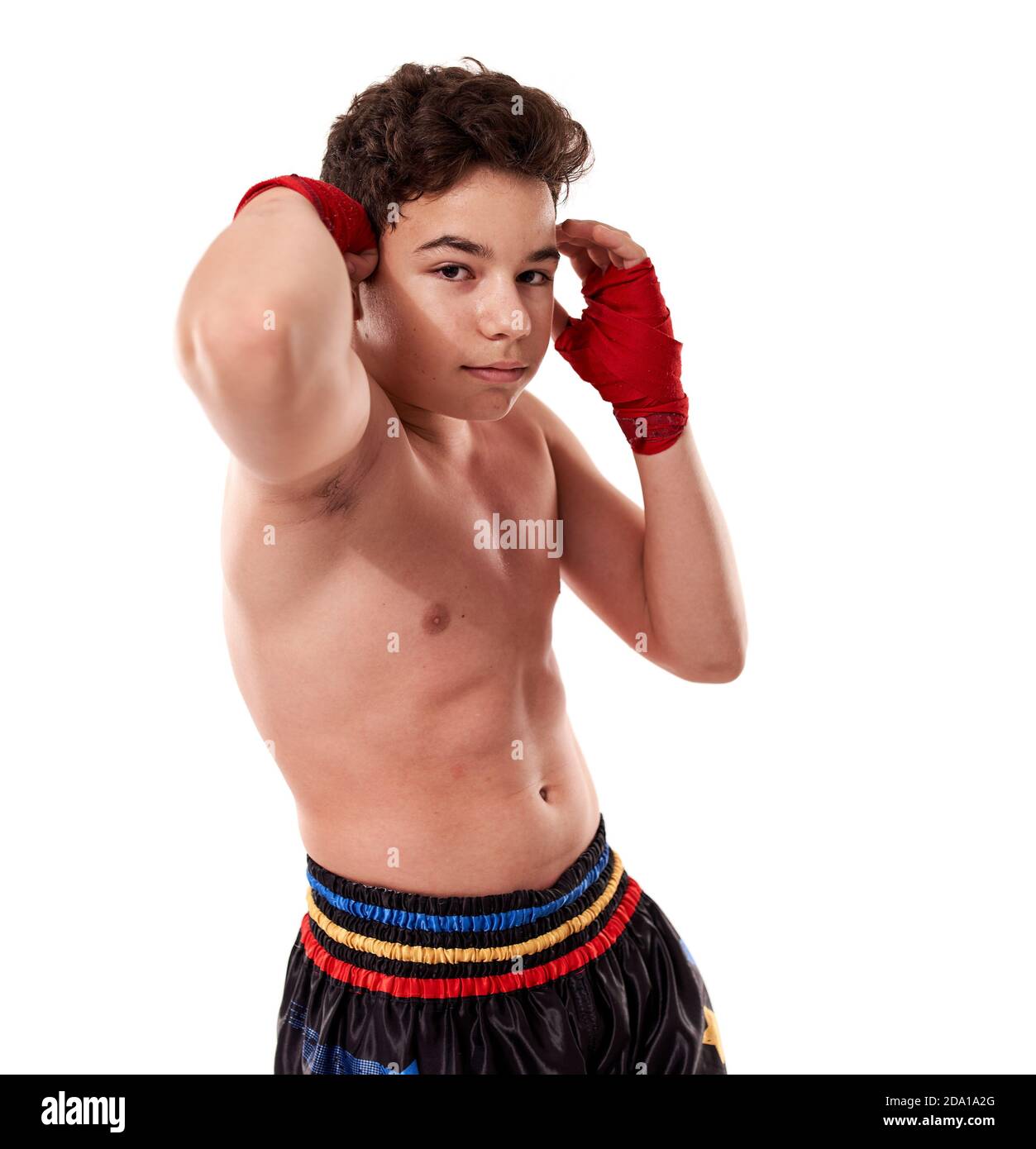 Young kickboxer training shadow boxing, isolated on white background ...
