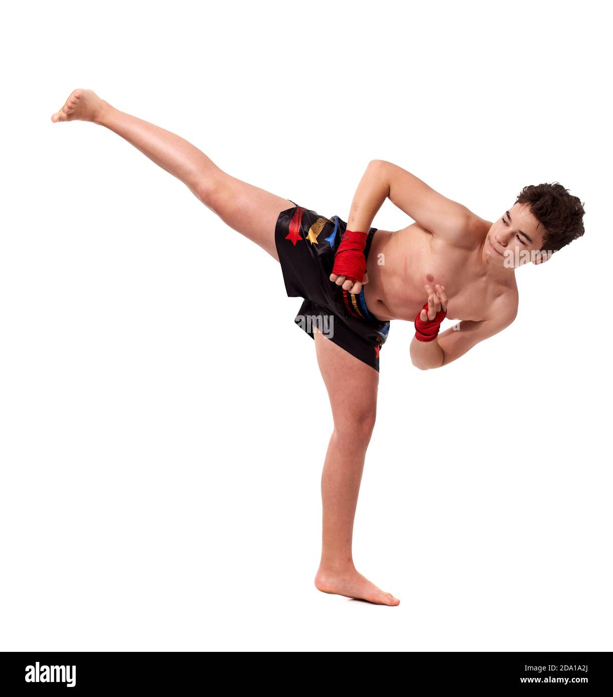 Young kickboxer training shadow boxing, isolated on white background ...