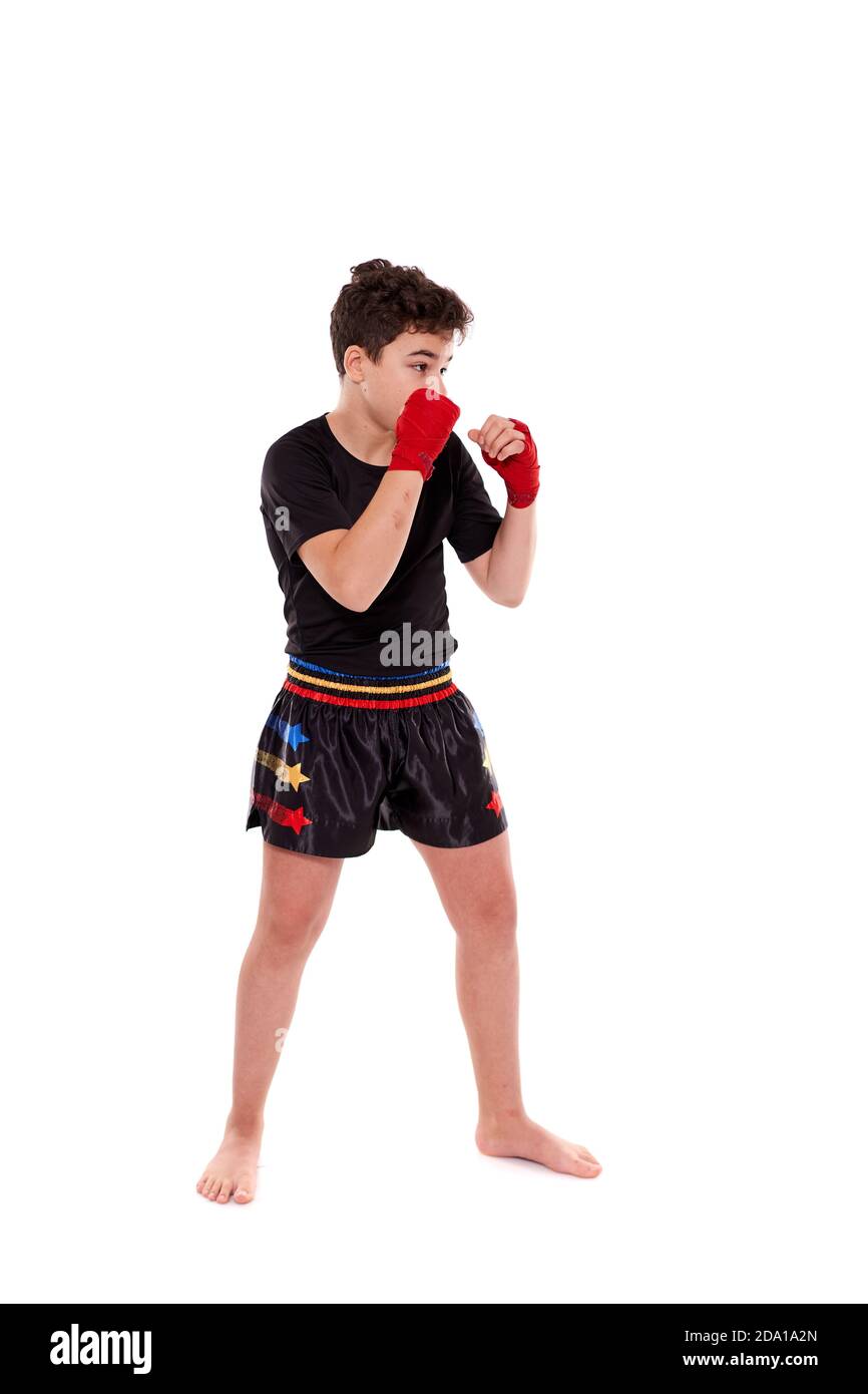 Young kickboxer training shadow boxing, isolated on white background ...