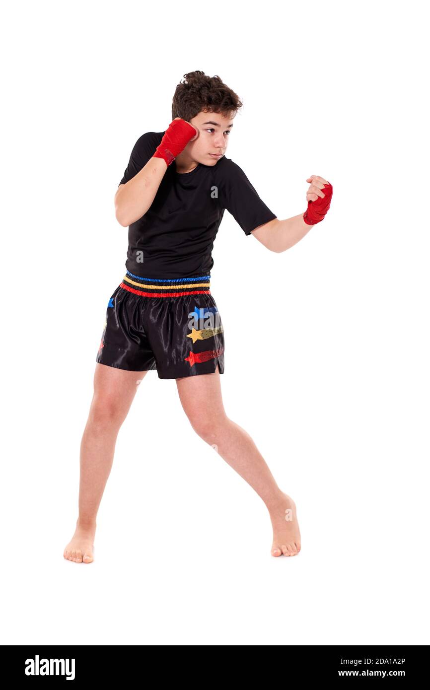 Young kickboxer training shadow boxing, isolated on white background ...
