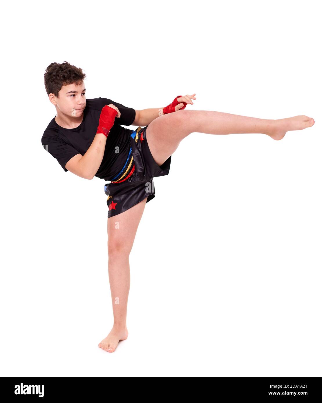 Young kickboxer training shadow boxing, isolated on white background ...