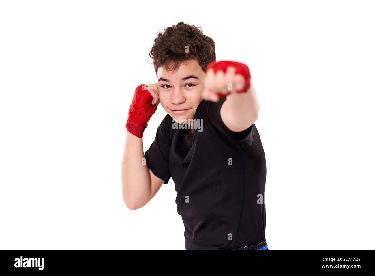 Young kickboxer training shadow boxing, isolated on white background ...