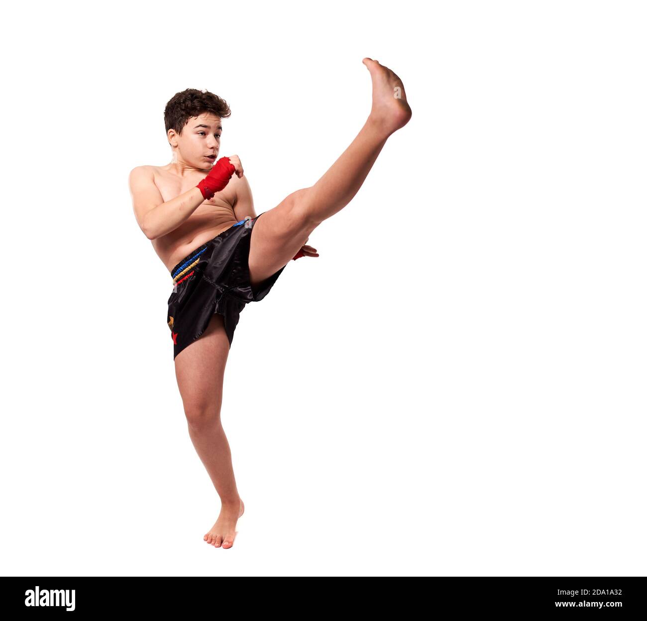 Young kickboxer training shadow boxing, isolated on white background ...