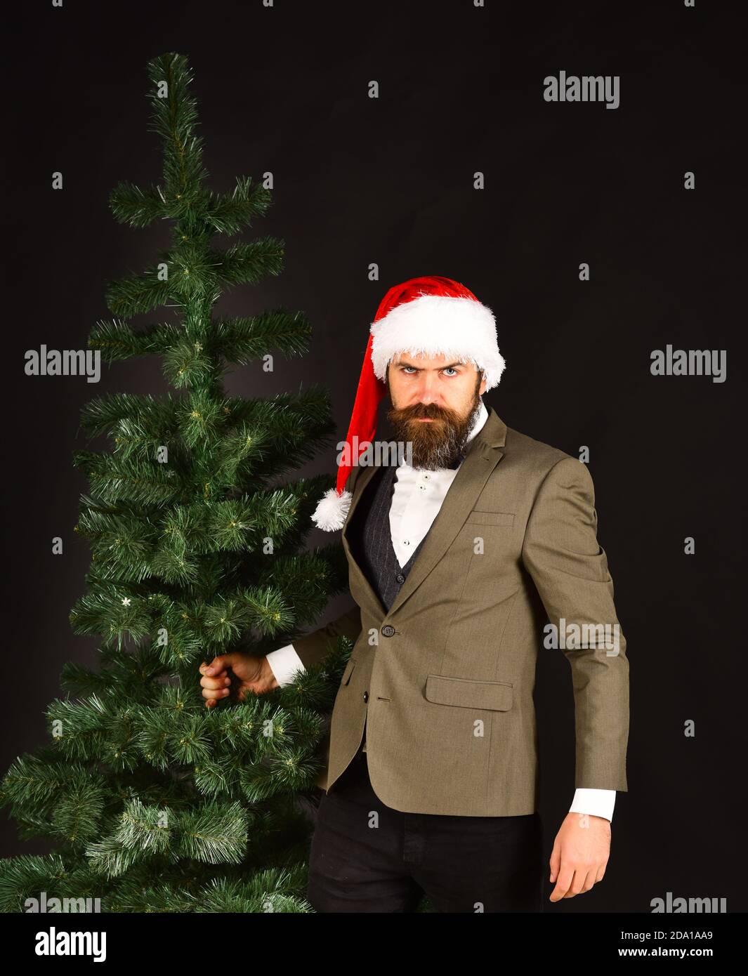 Business and winter vacation concept. Manager with beard gets ready for ...