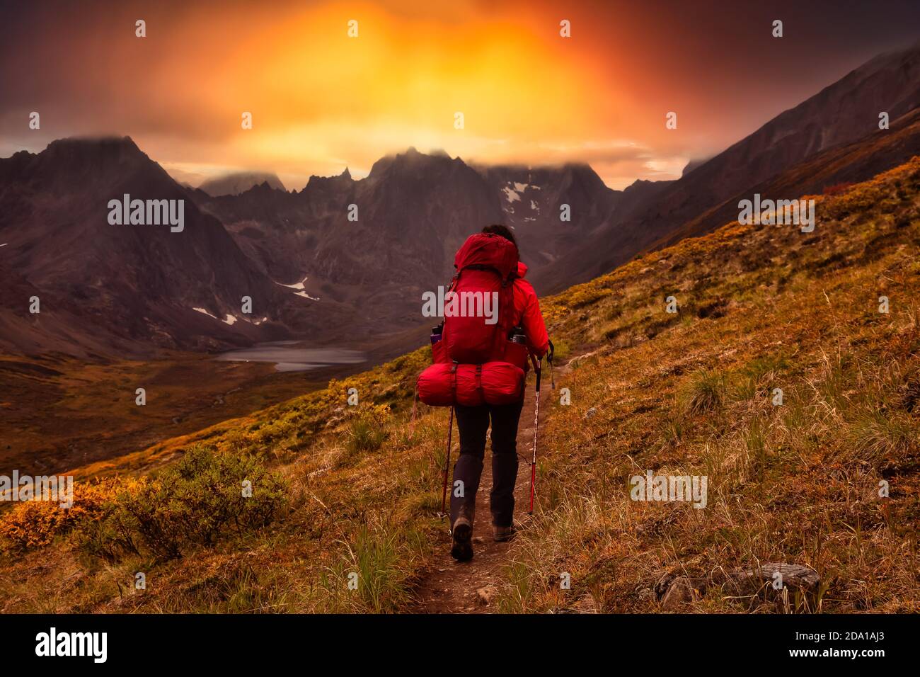 Woman Backpacking on Scenic Hiking Trail to Lake surrounded by ...