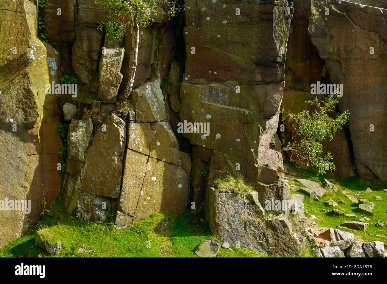 Abandoned working face of gritstone in bright sunshine at Bole Hill ...