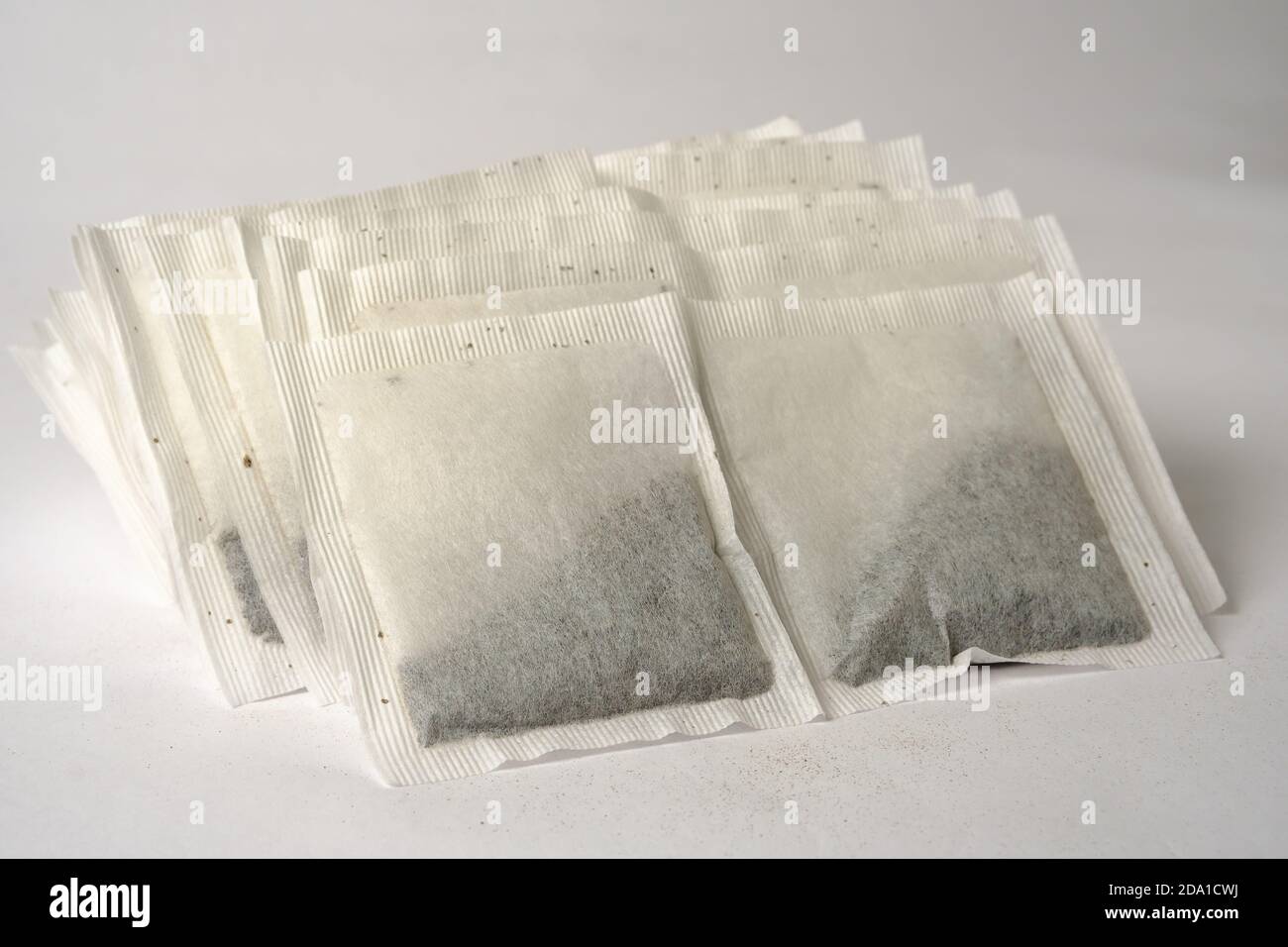 Pile pair of English tea bags isolated on white Stock Photo - Alamy