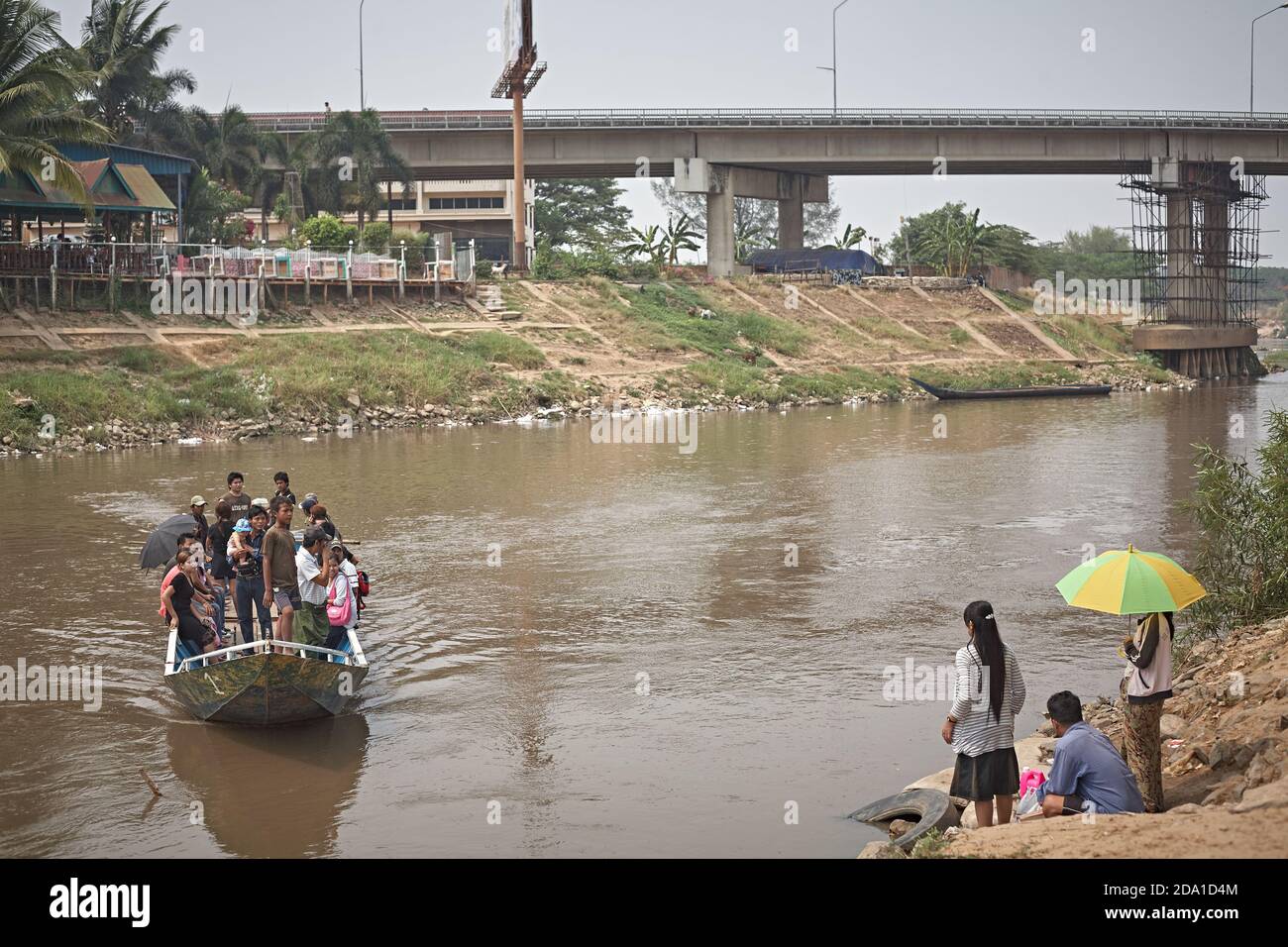 Mae Sot, Thailand. April 2012. Passenger boat crossing the river that ...