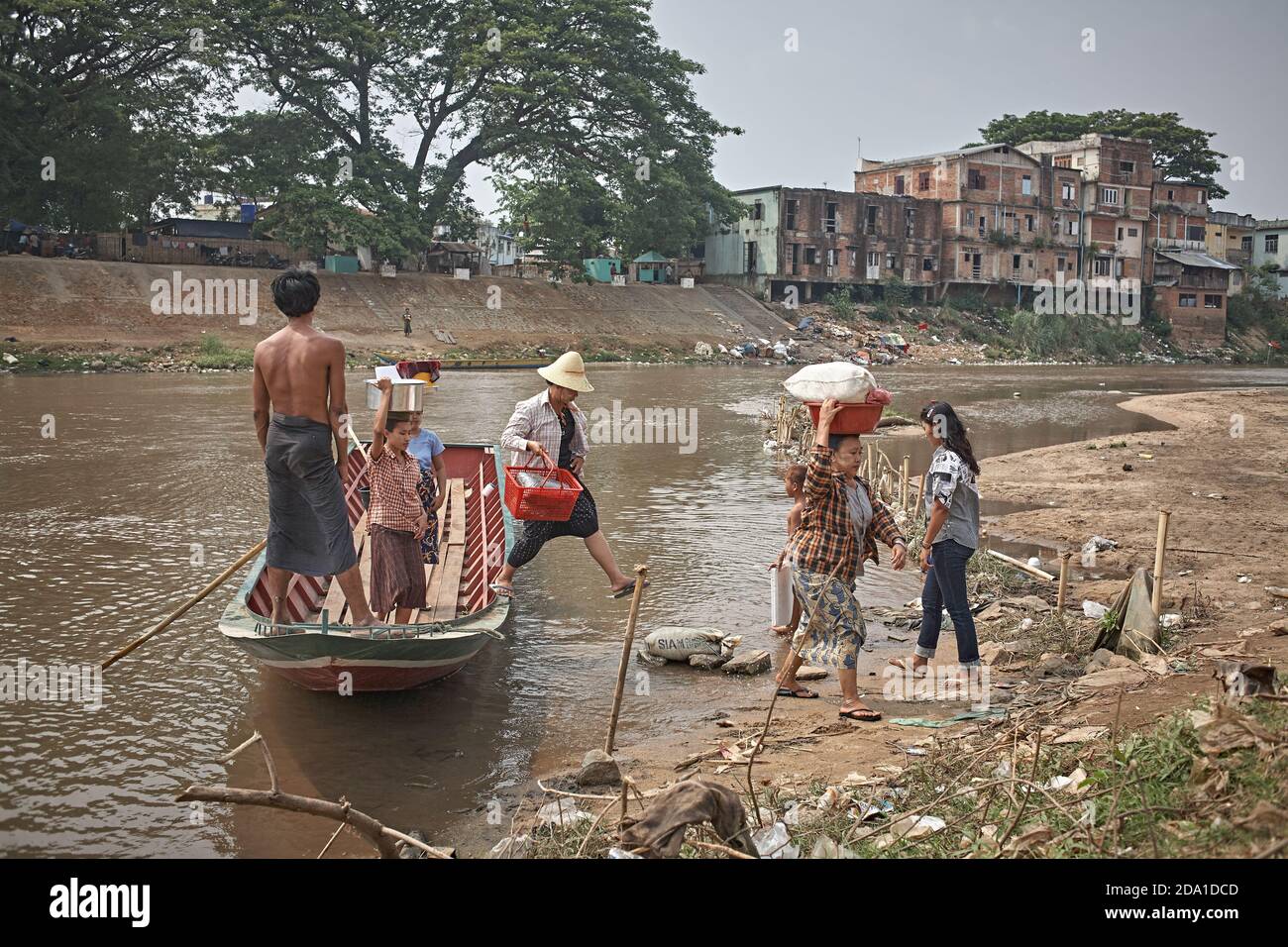 Mae Sot, Thailand. April 2012. Passenger boat crossing the river that ...