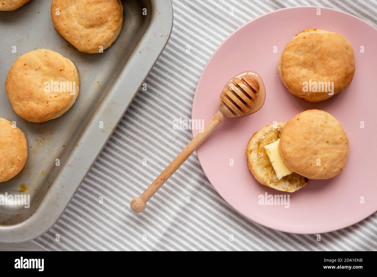Homemade Flaky Buttermilk Biscuits on a pink plate, top view. Flat lay ...