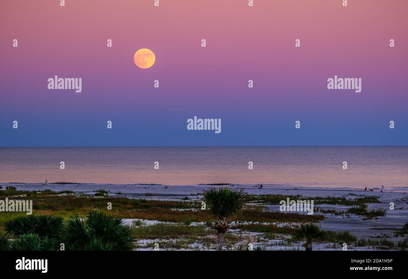 Moonrise Over Beach Stock Photo - Alamy