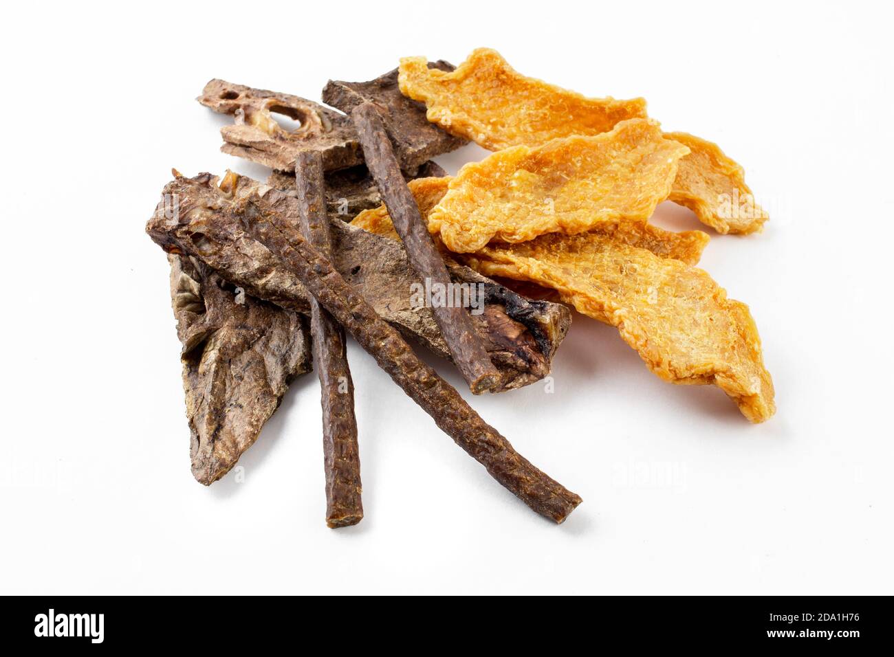 a mix of dog treats, dried chicken tenders, dried beef tendon, and ...