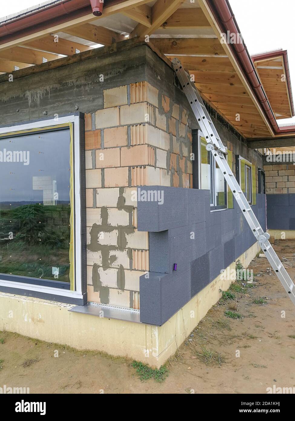Thermal insulation with graphite polystyrene on the house wall at the ...