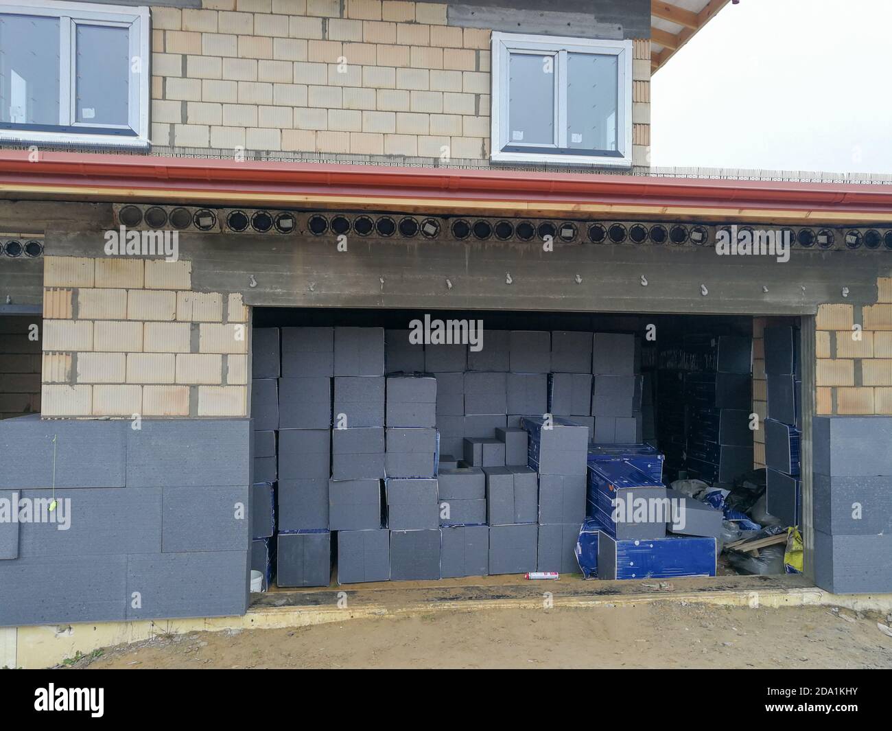House under construction with garage filled with graphite polystyrene ...