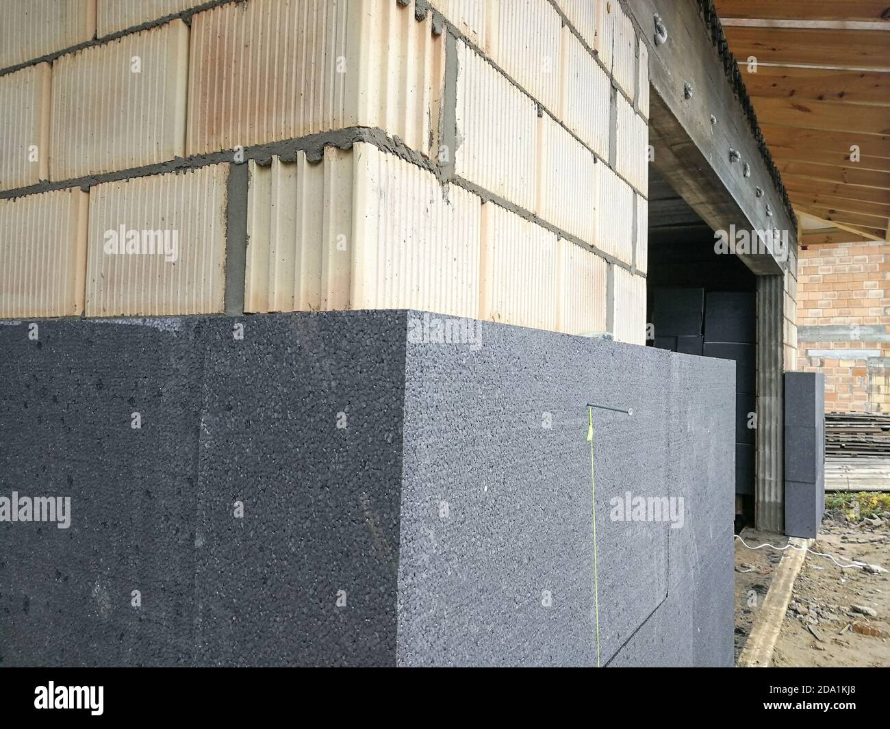 Thermal insulation with graphite polystyrene on the house wall at the ...