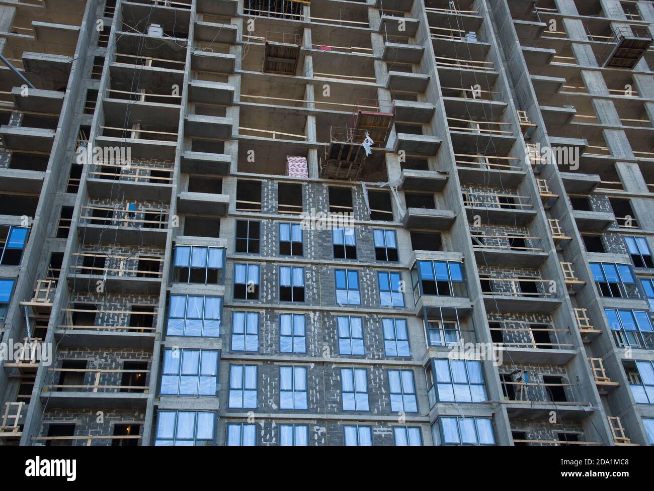 Installation of double-glazed windows in a multi-storey building at a ...