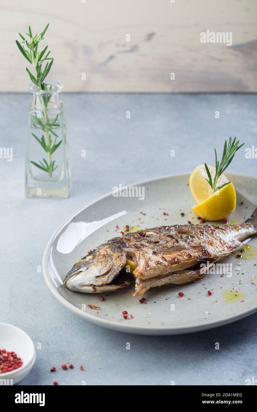Delicious baked fish with lemon and spices from the chef. Original ...