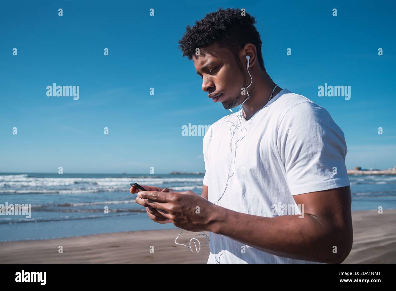 Man using earphones mobile listening hi-res stock photography and ...