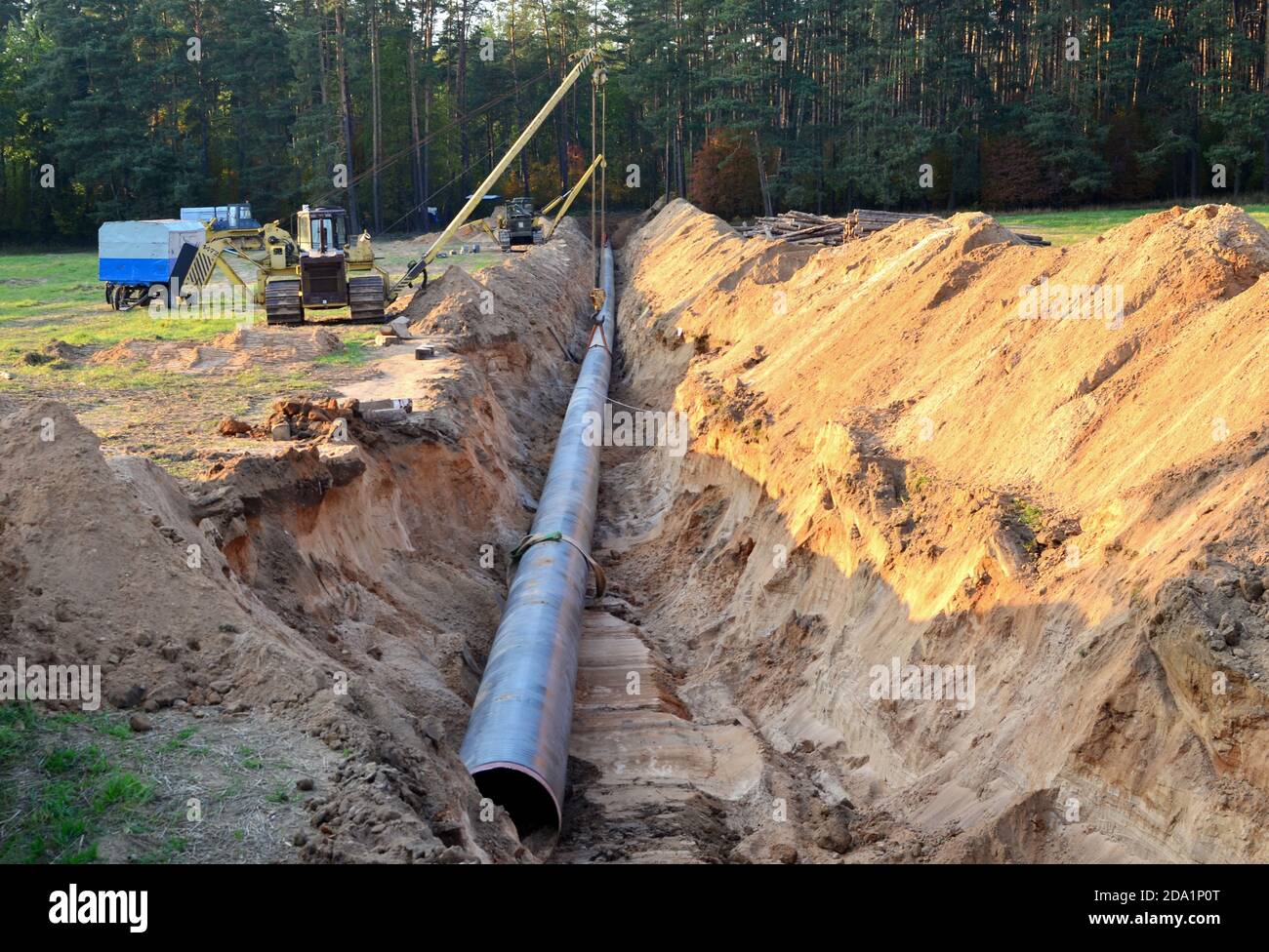 Natural gas pipeline construction work. A dug trench in the ground for ...