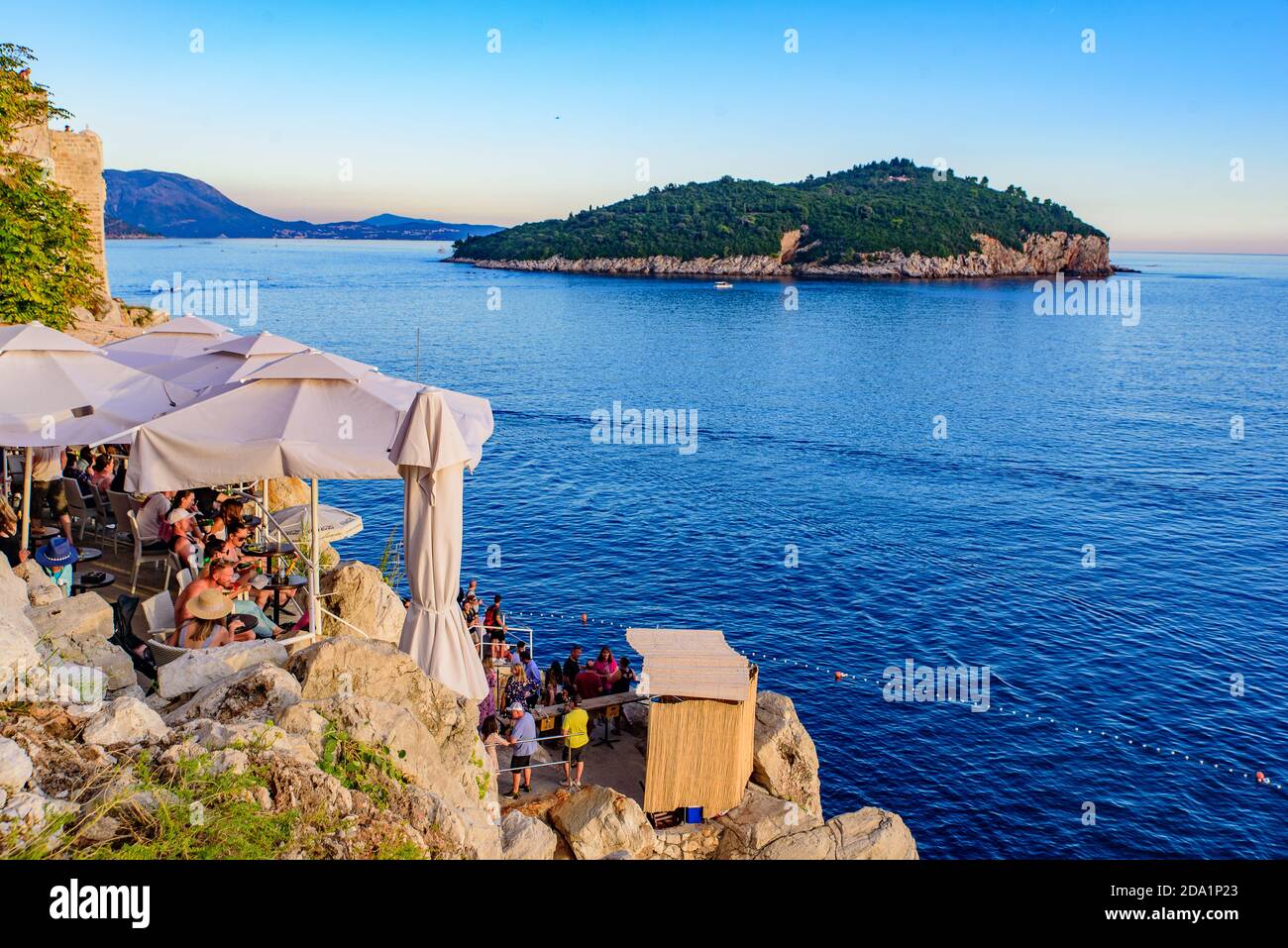 People enjoying the view at cliff-side bar in the old city of Dubrovnik ...