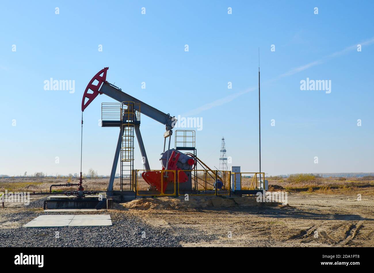 Oil drilling derricks at desert oilfield for fossil fuels output and ...