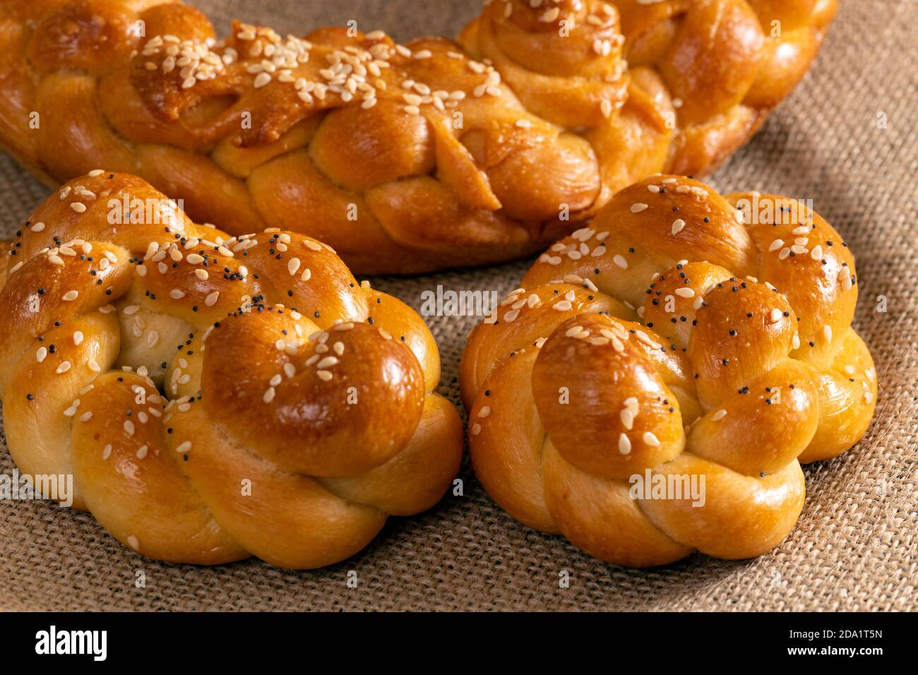 East European type braided homemade white bread isolated on a linen ...