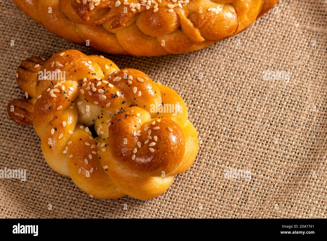 East European type braided homemade white bread isolated on a linen ...