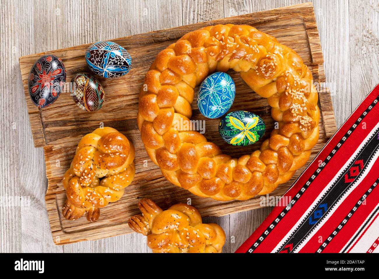 East European braided homemade bread with traditional painted eggs ...