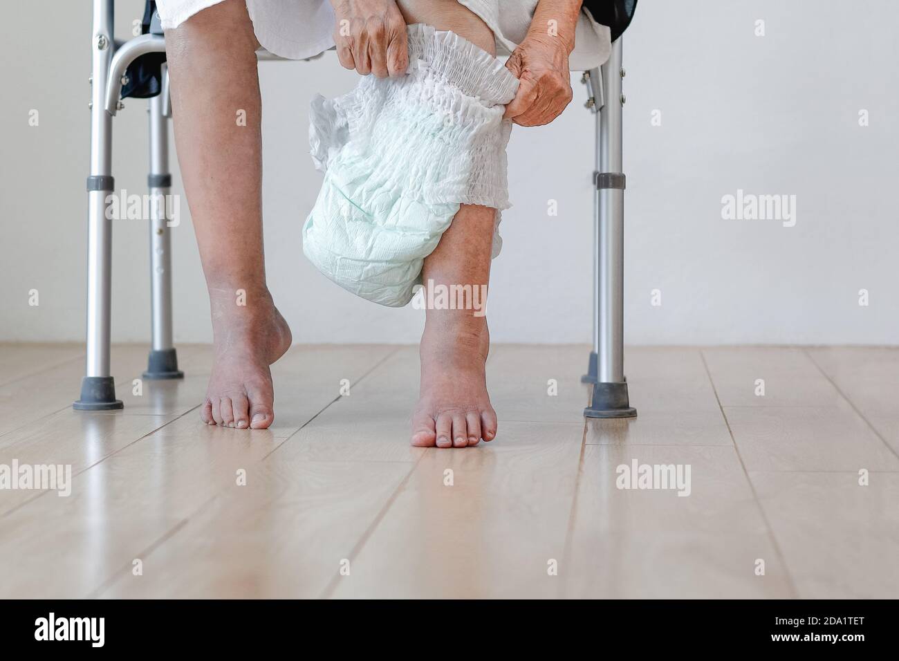 elderly woman changing diaper Stock Photo - Alamy
