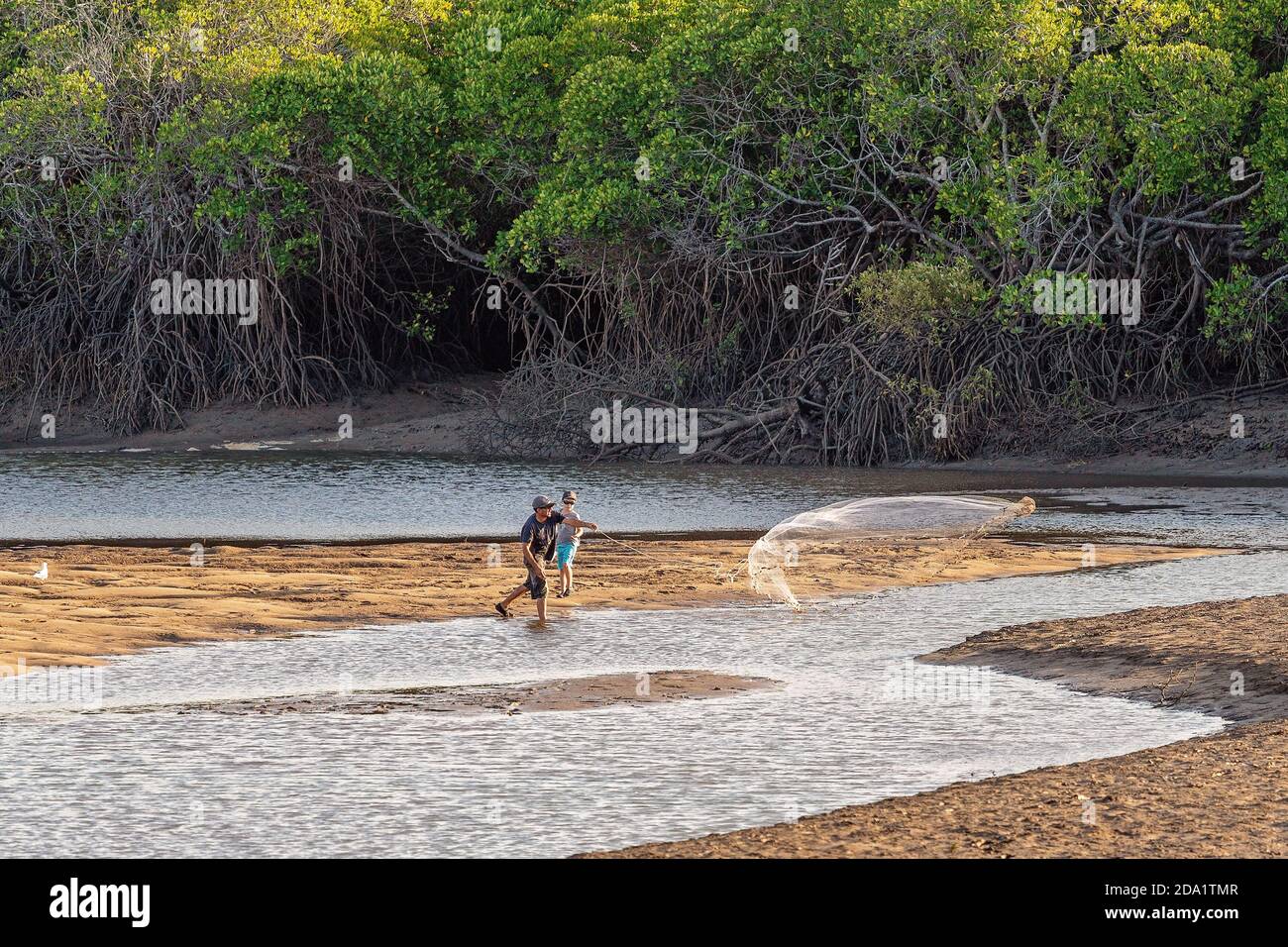 Mackay, Queensland, Australia - October 2019: A man and child casting a ...