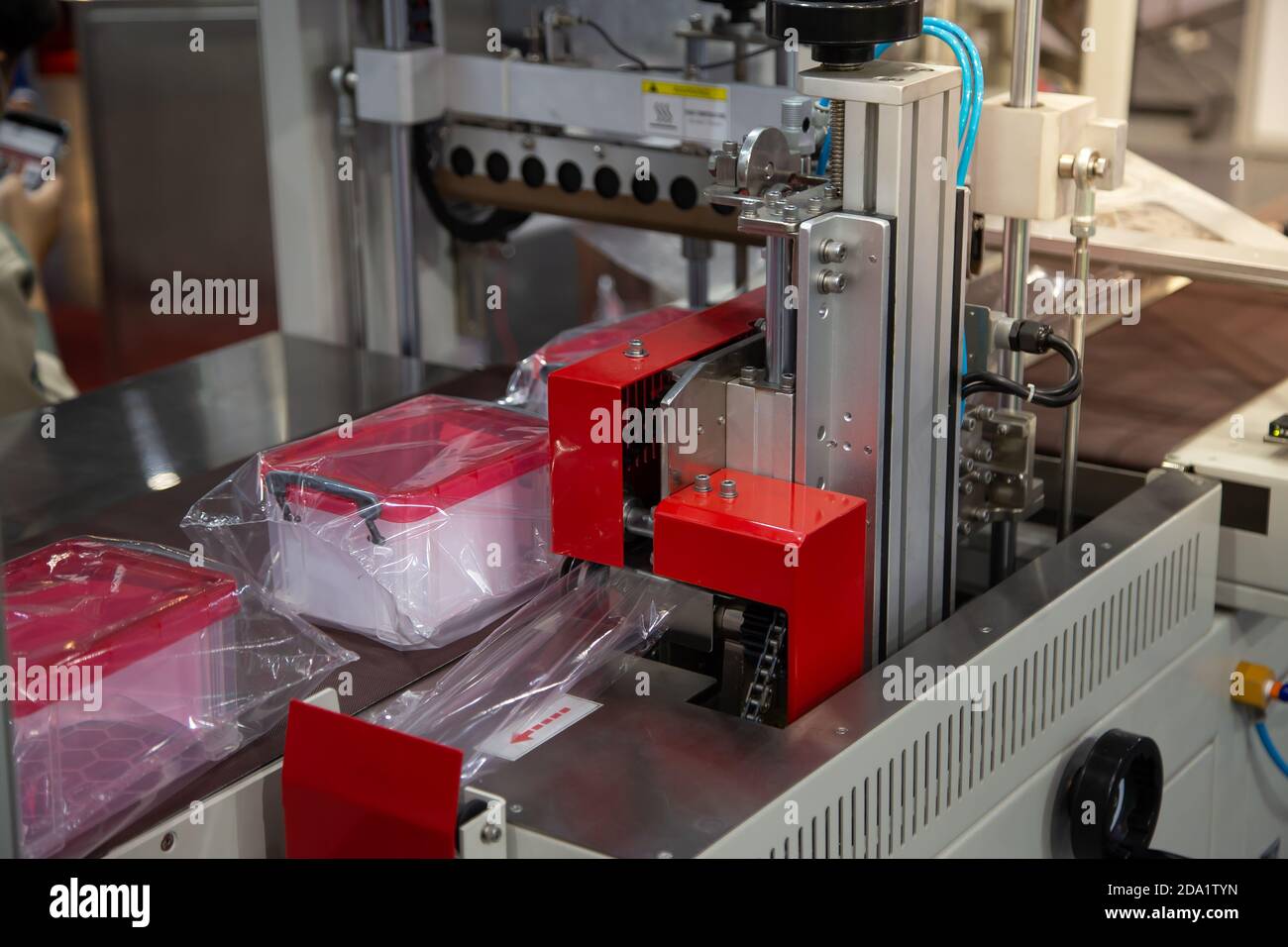 Automatic food container flow wrapping machine. Food packaging machine ...