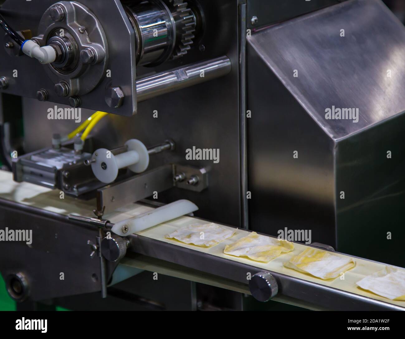 Process of dough sheet pressing machine in food industry Stock Photo ...