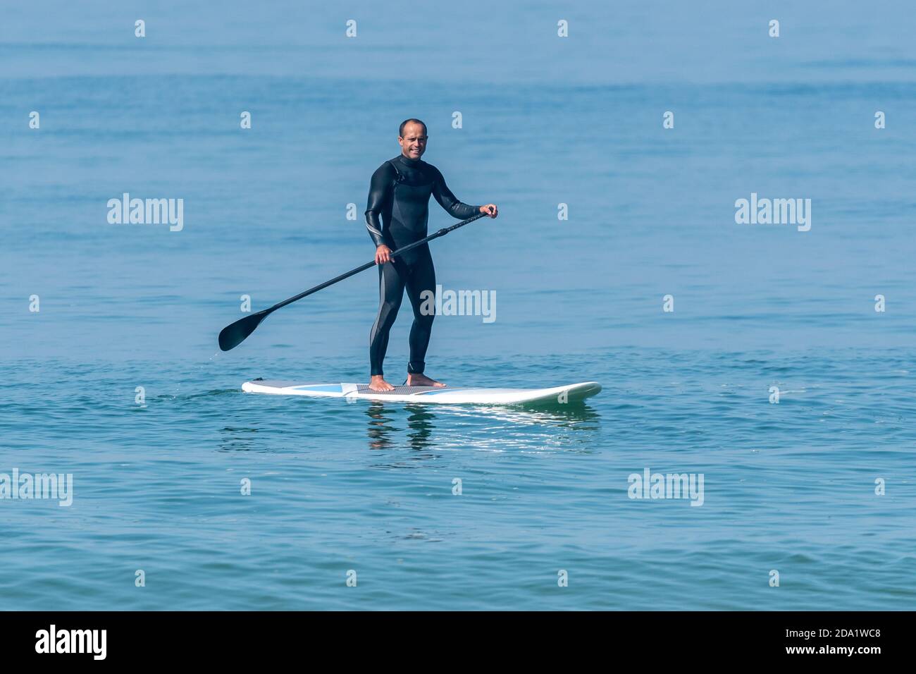 Stand up paddle surfer on the atlantic ocean Stock Photo - Alamy