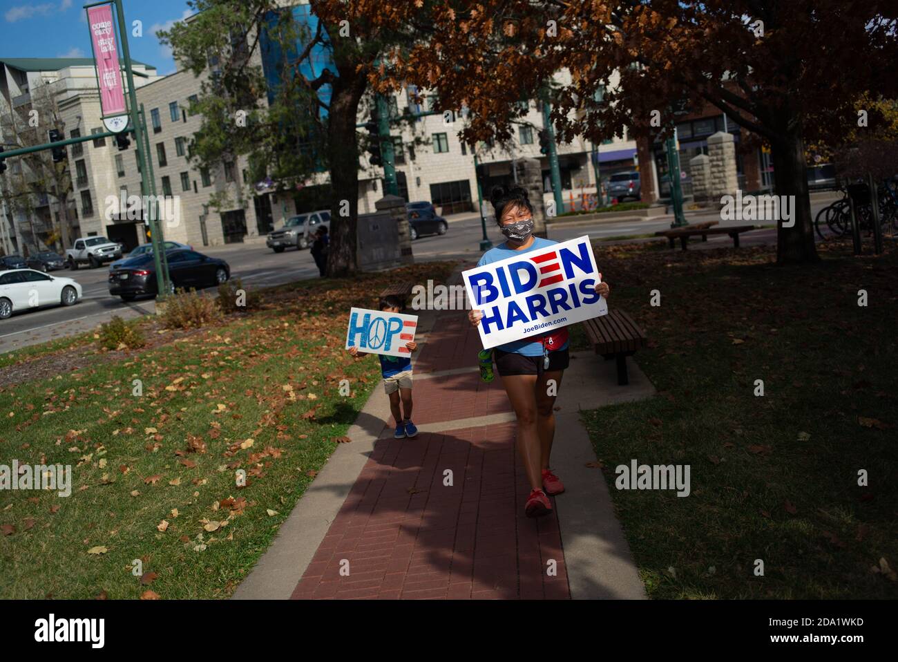 Manhattan, Kansas, USA. 8th Nov, 2020. KIM ZITO, right, walks with her ...