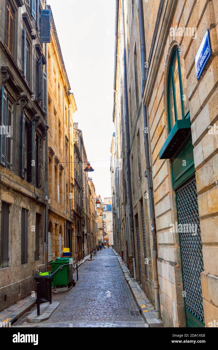 Narrow street of old town in Bordeaux . View of old traditional french ...