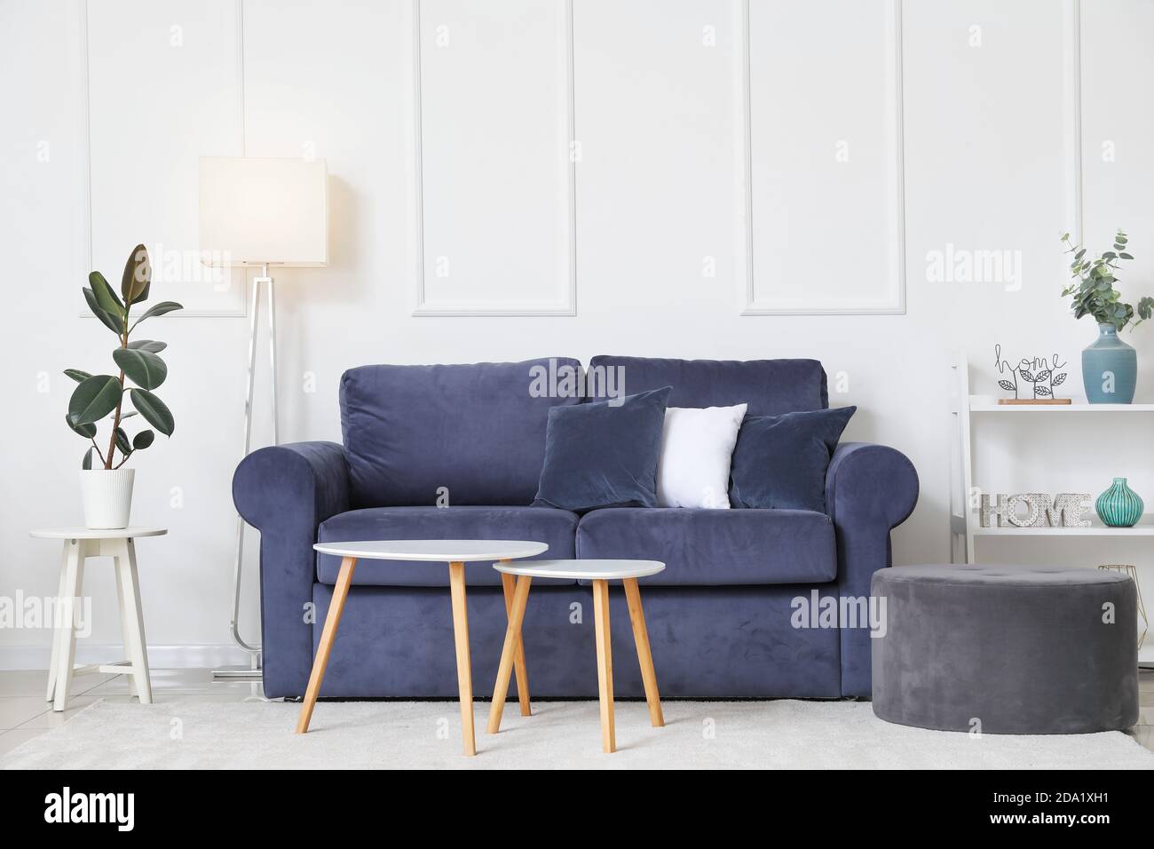 Interior of light modern living room with sofa Stock Photo - Alamy